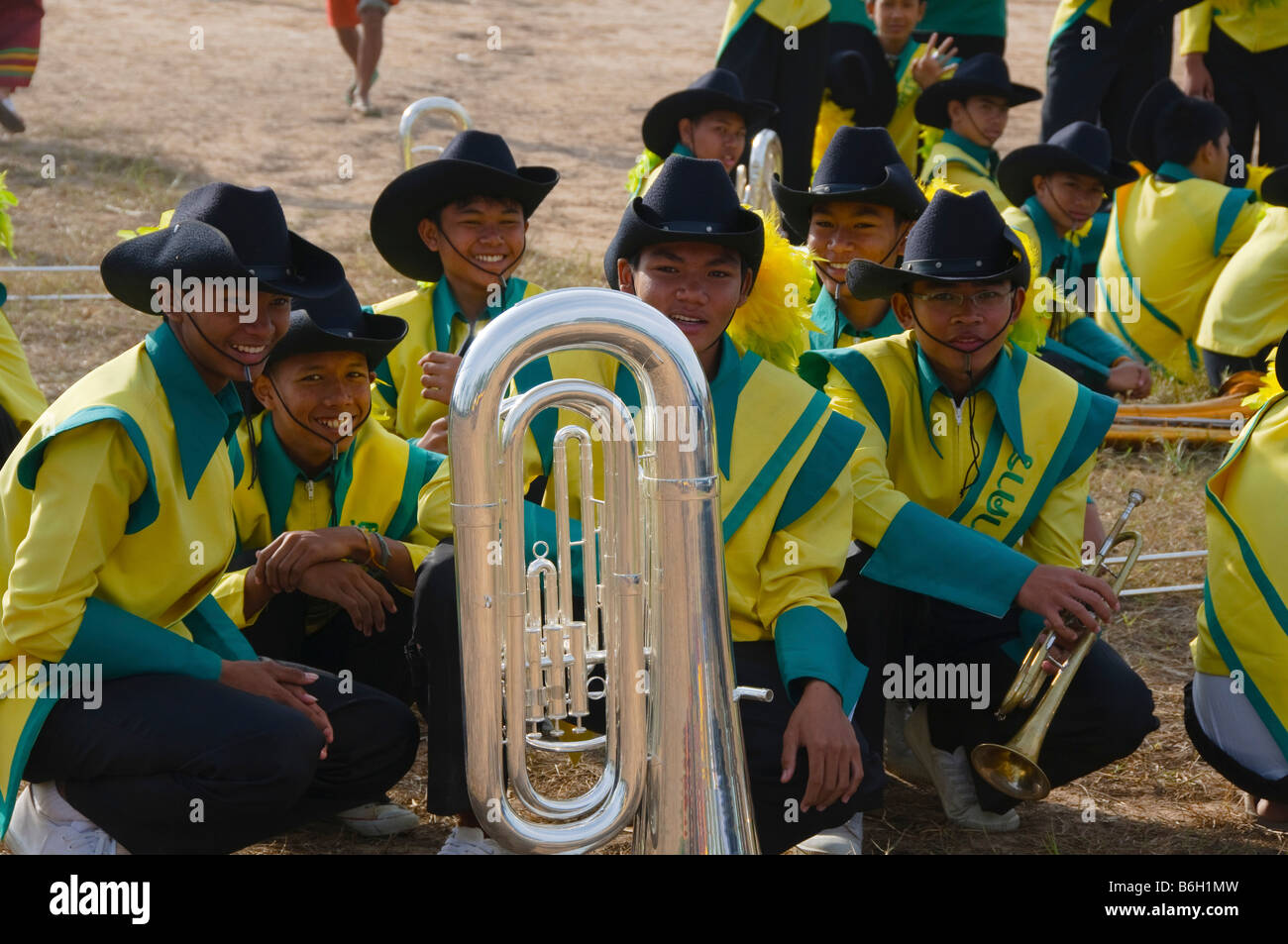 Thai band members gathered around a trombone Stock Photo - Alamy