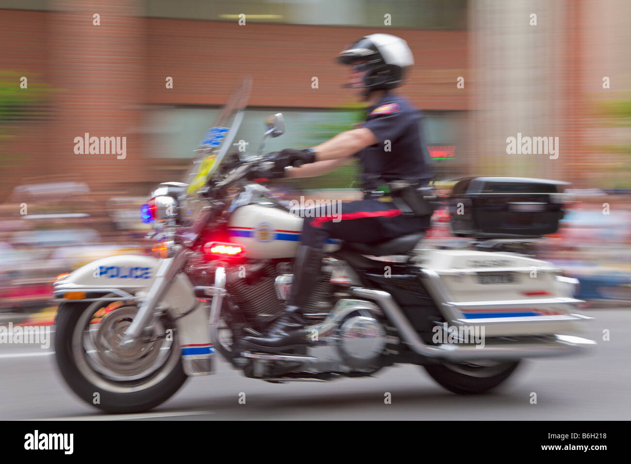 Police officer riding a motorbike hi-res stock photography and images ...