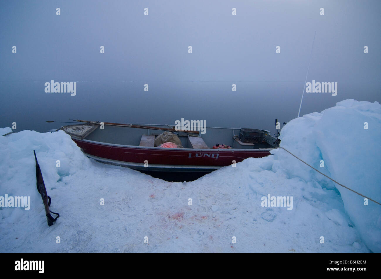 skiff used by Inupiaq whalers on the edge of an open lead in a pack ice ...