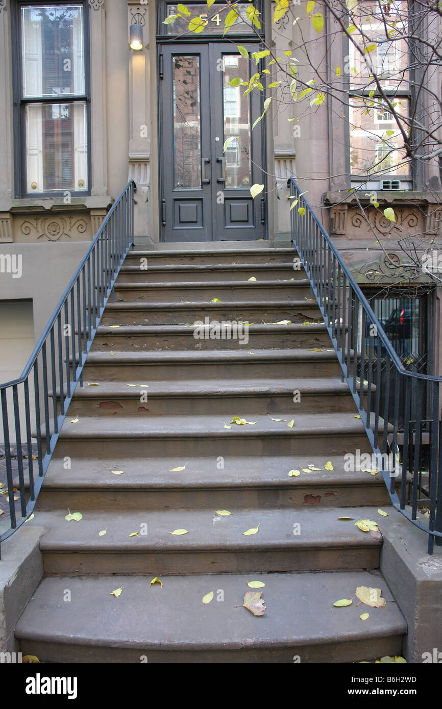 Apartment steps with autumn leaves Stock Photo - Alamy