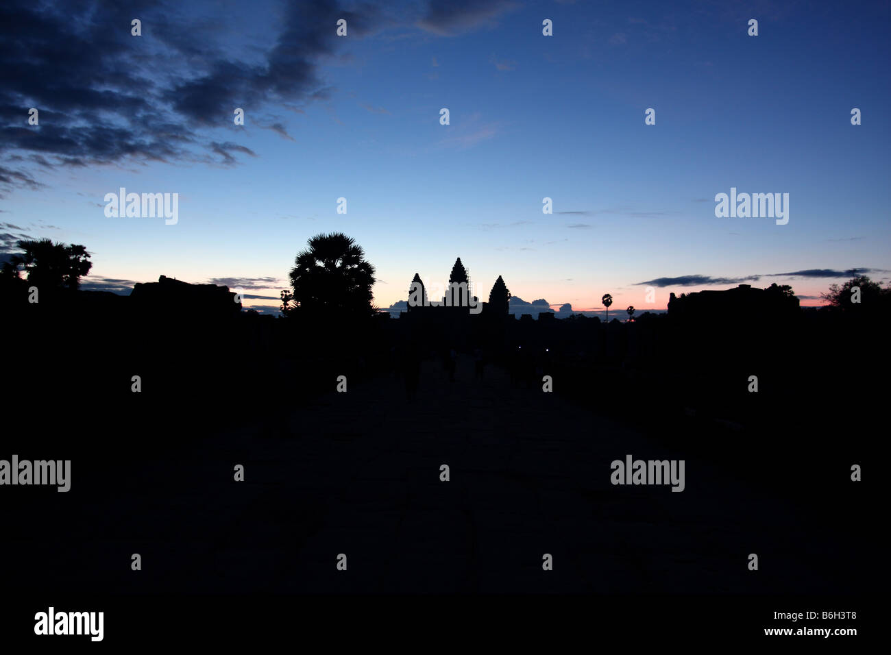 Black shape of Angkor Wat temple taken before Sunrise with a clear blue ...