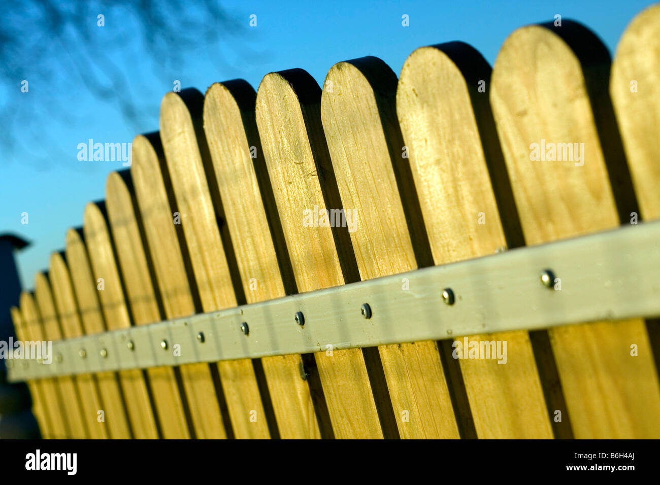 Wooden fence illuminated by the evening sunlight Stock Photo - Alamy
