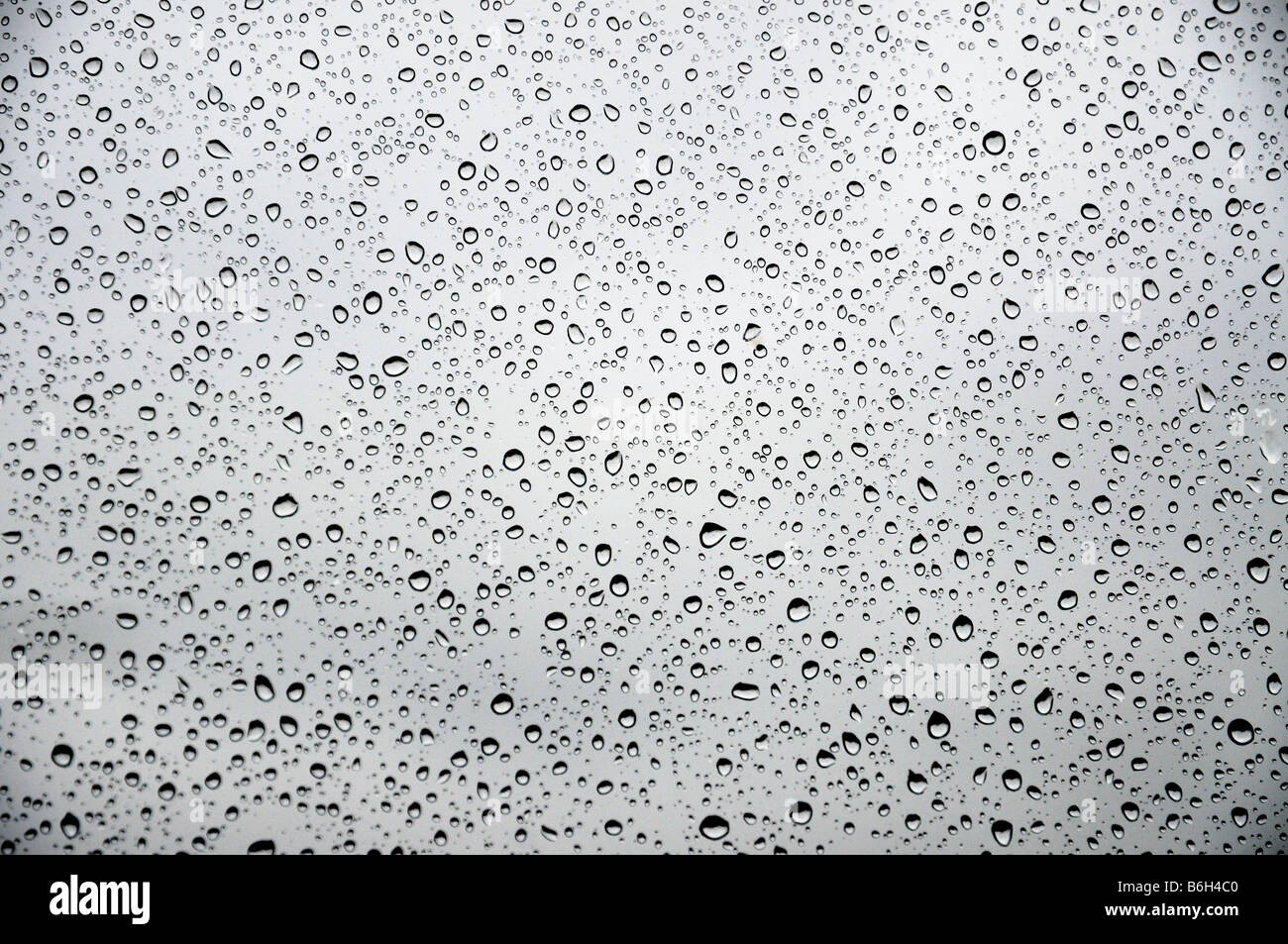 A rain splattered window after a rain storm Stock Photo - Alamy