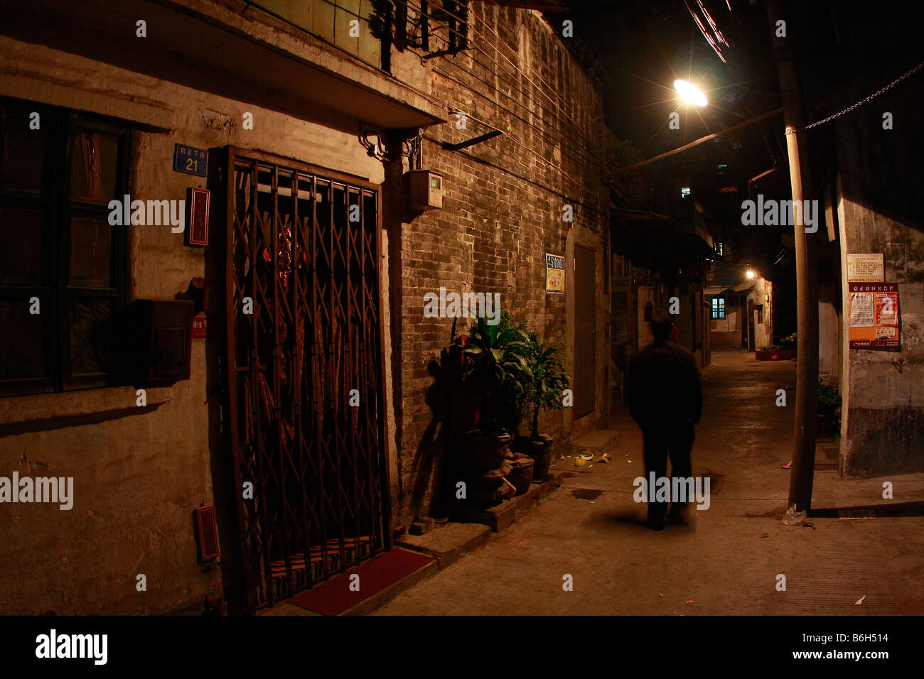 Empty alley side street in the evening in China, close tightly locked ...