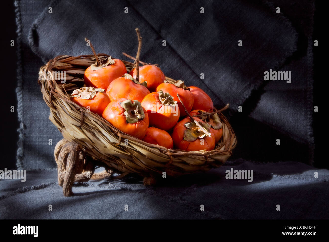 basket of persimmons Stock Photo - Alamy