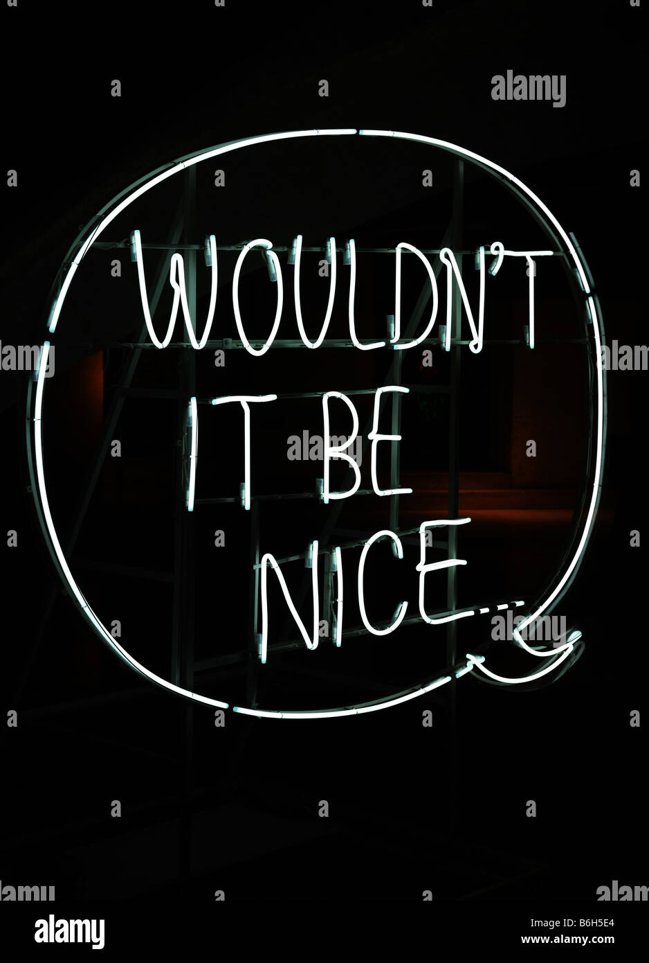 A "Wouldn't it be Nice" sign in white neon at night Stock Photo - Alamy