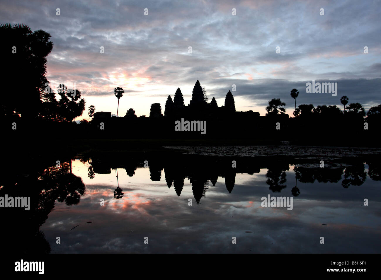 Black shape of Angkor Wat temple taken before Sunrise with clear blue ...