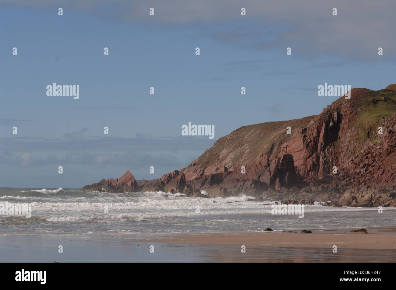 Waves and cliff West Dale beach Dale Pembrokeshire Wales UK Europe ...