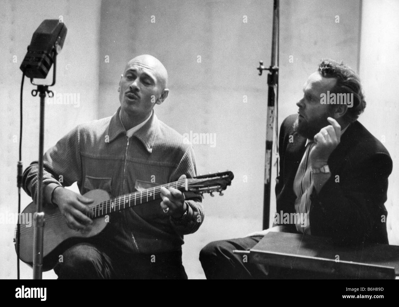 YUL BRYNNER US film actor records a song watched by stuntman Mickey ...