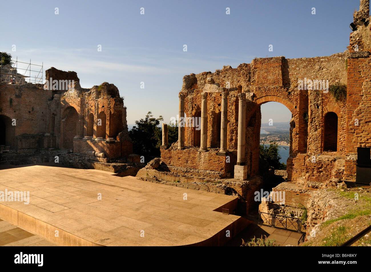 The Ancient Greek Theatre with Mount Etna behind in Taormina in Sicily ...