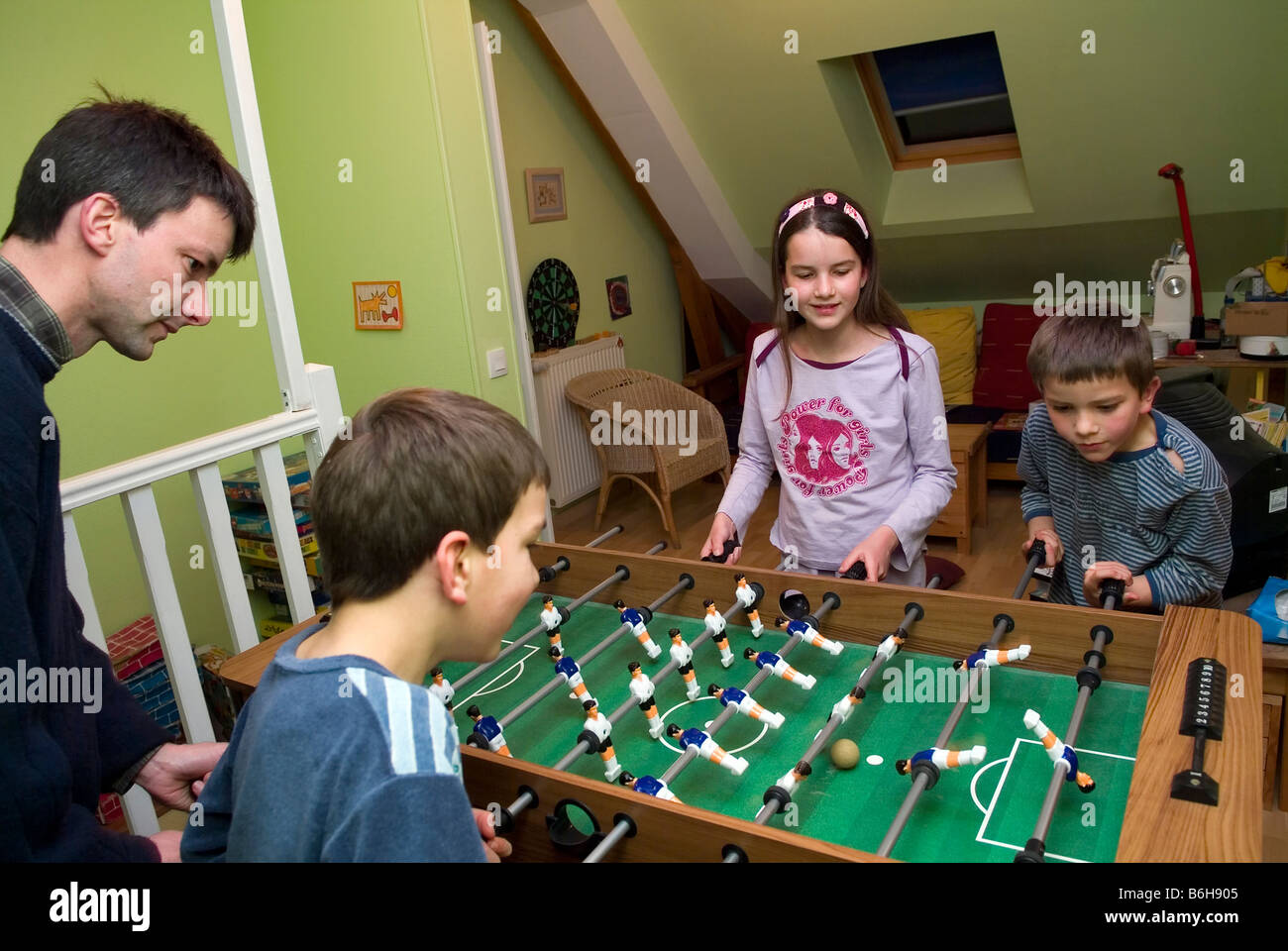 Kid playing soccer table game hi-res stock photography and images - Alamy
