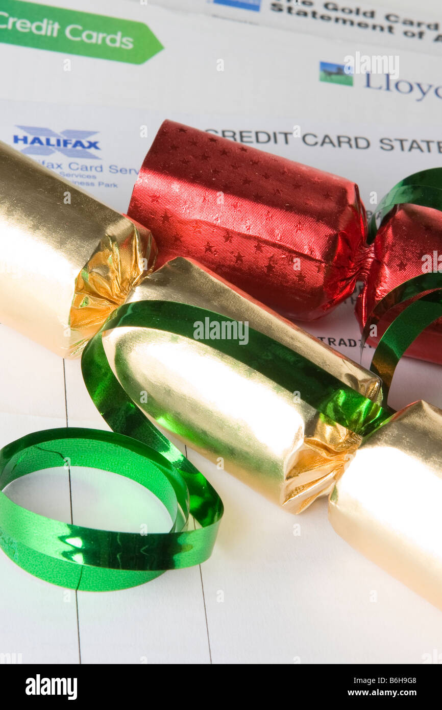 Credit card bills and Christmas crackers Stock Photo - Alamy