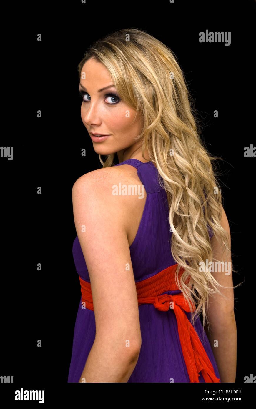 woman looking over her shoulder Stock Photo - Alamy