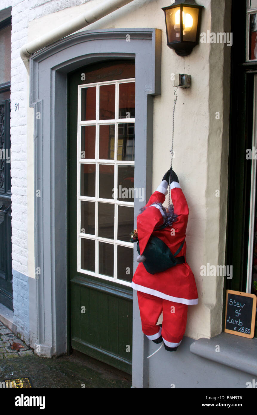A Santa Claus puppet on a house in Bruges Stock Photo - Alamy