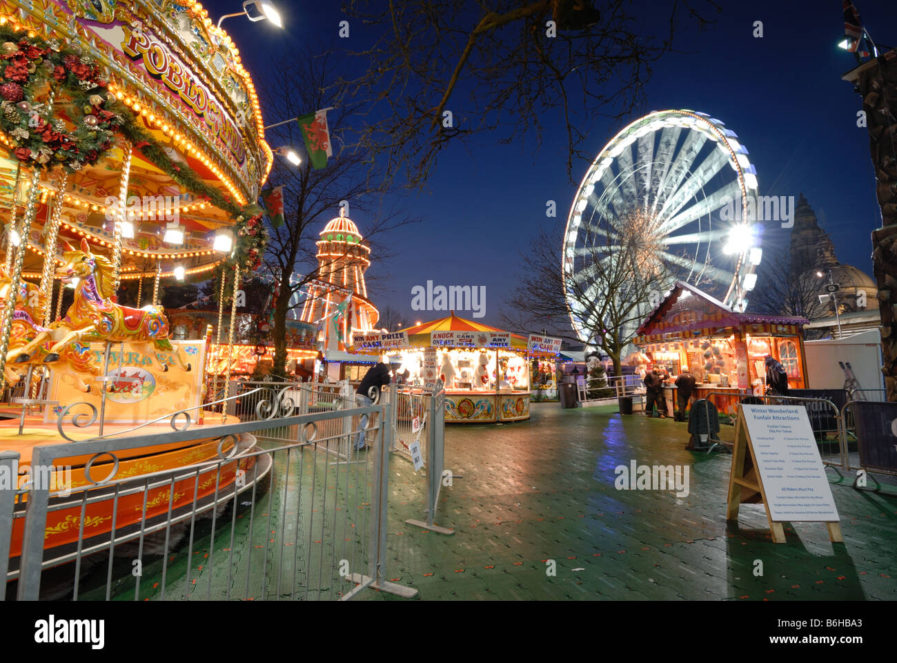 Cardiff Winter Wonderland's carousels and funfair in front of the ...