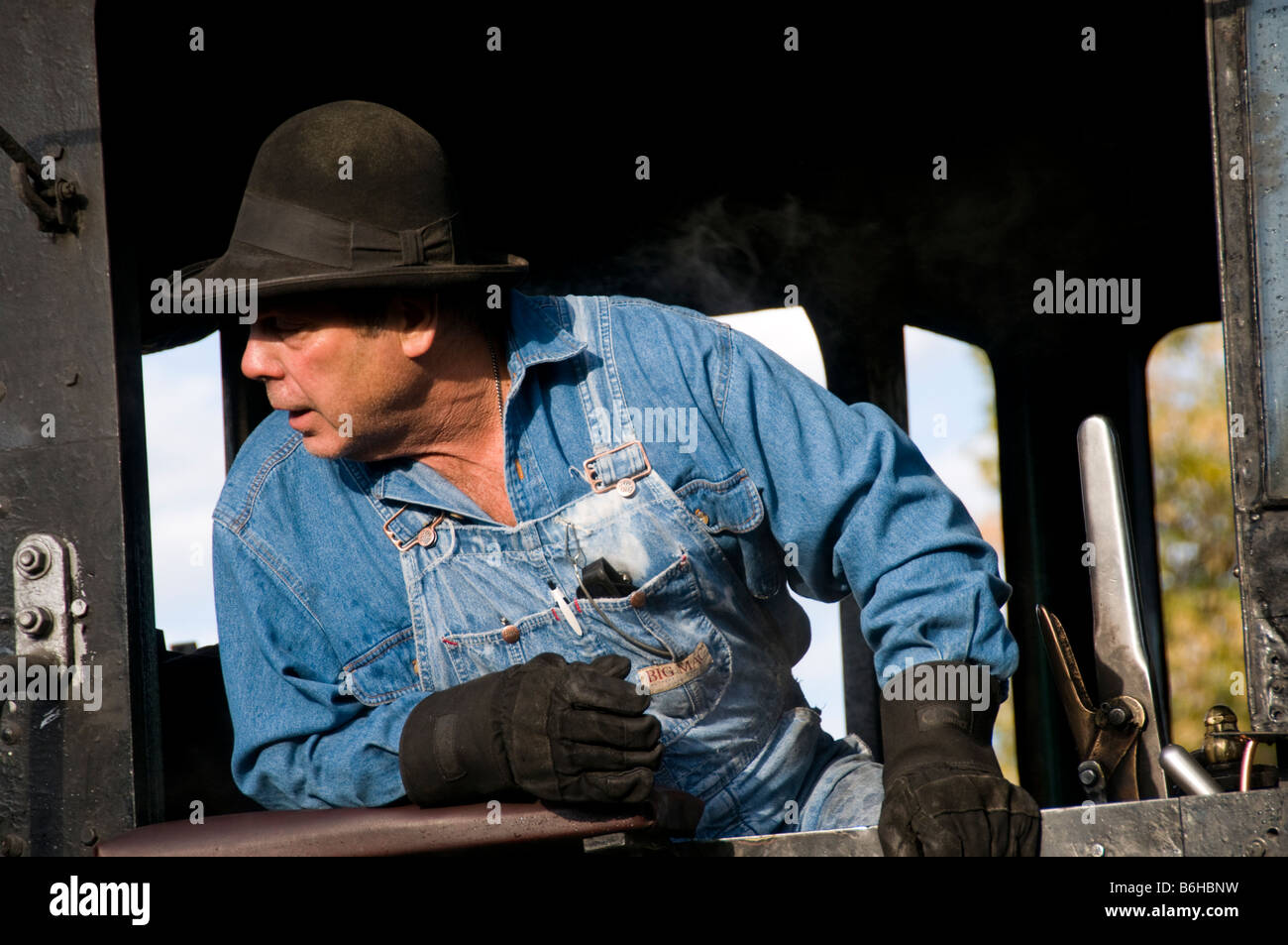 Train engineer looking out of cab on Old fashioned vintage locomotive ...
