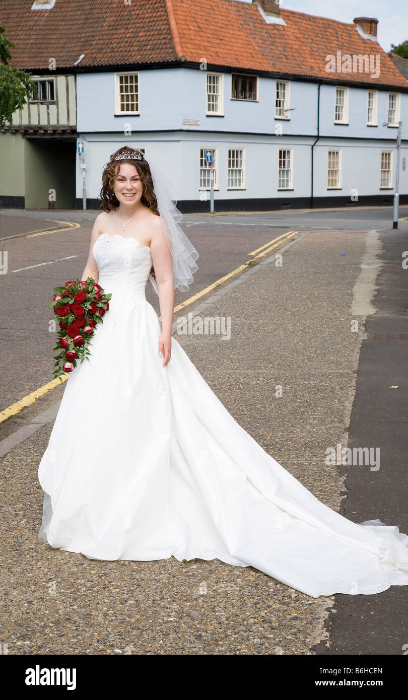 Bride in traditional white posing on Duke Street in Norwich Stock Photo ...