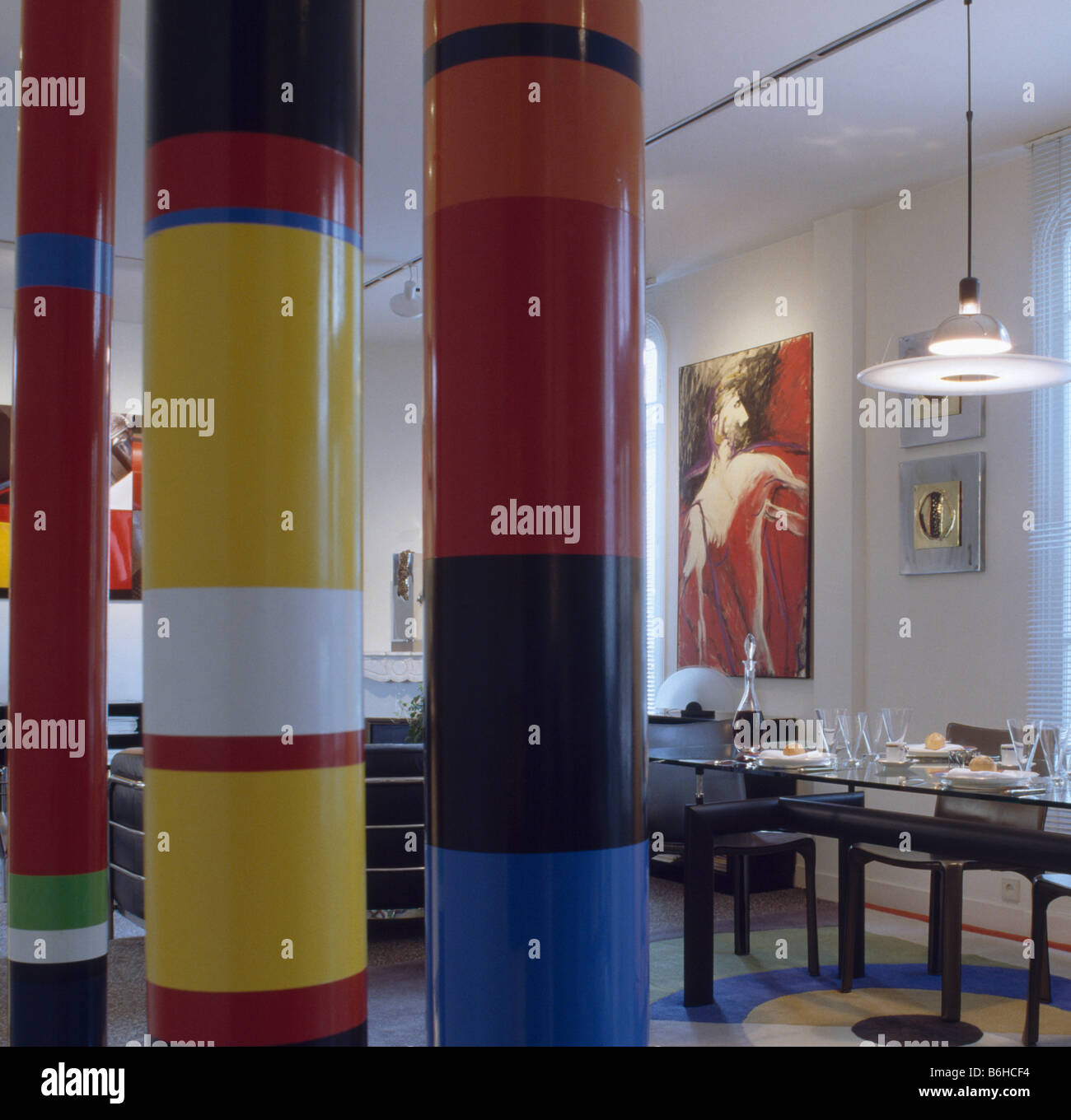 colourful pillar sculpture in modern dining room with pendant disc ...