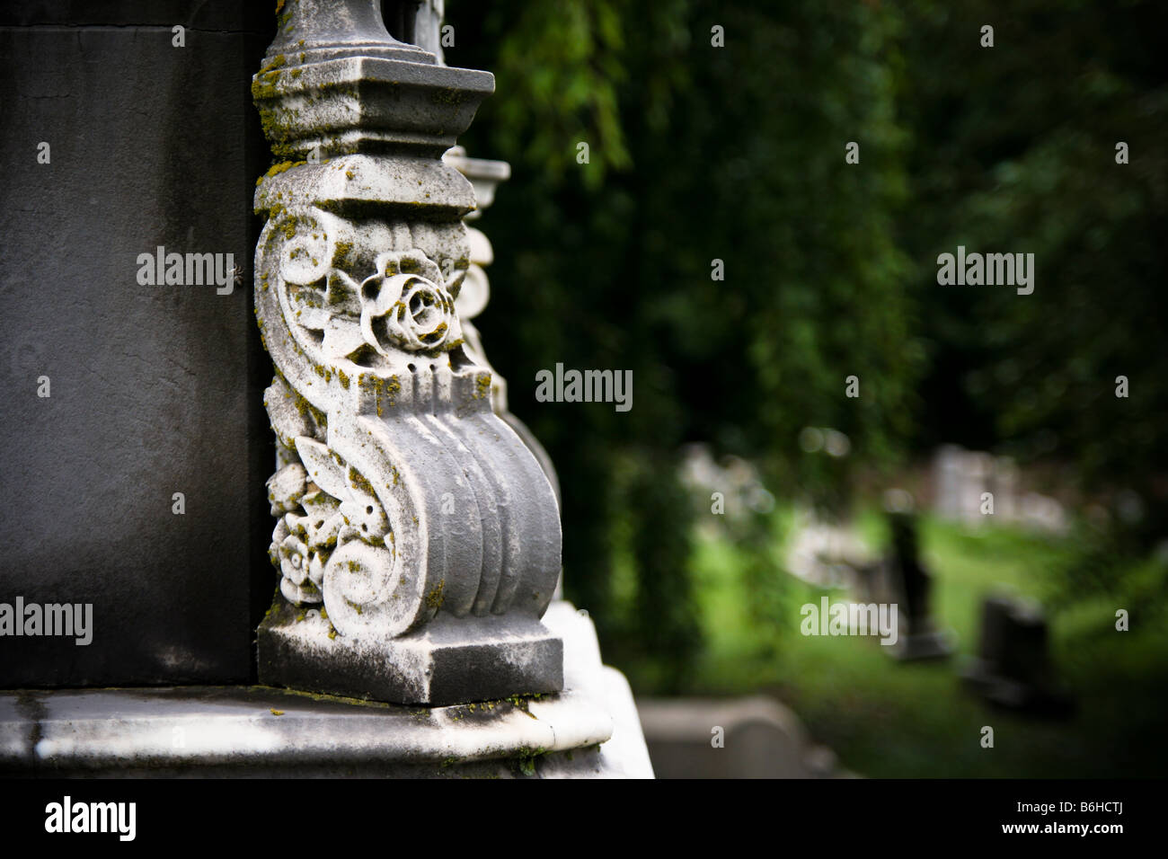 Detail of an ornate Victorian carved marble grave monument in an old ...