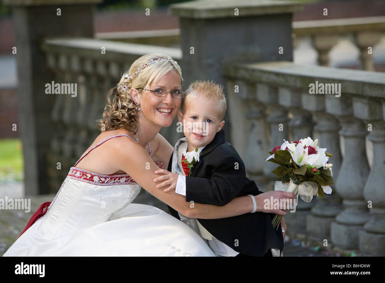 Bride with her page boy and son Stock Photo - Alamy