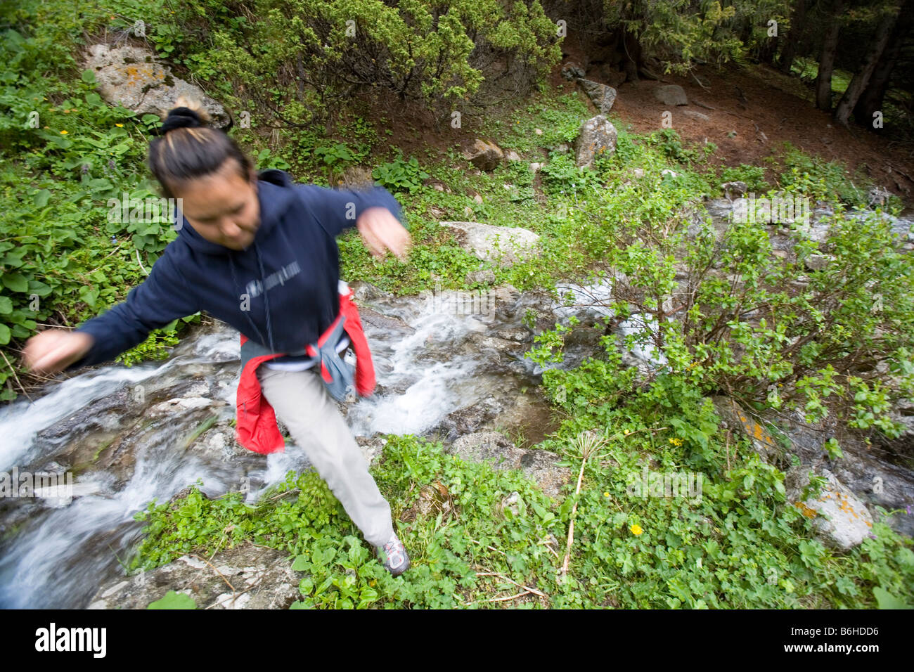 Jumping over a stream of water hi-res stock photography and images - Alamy
