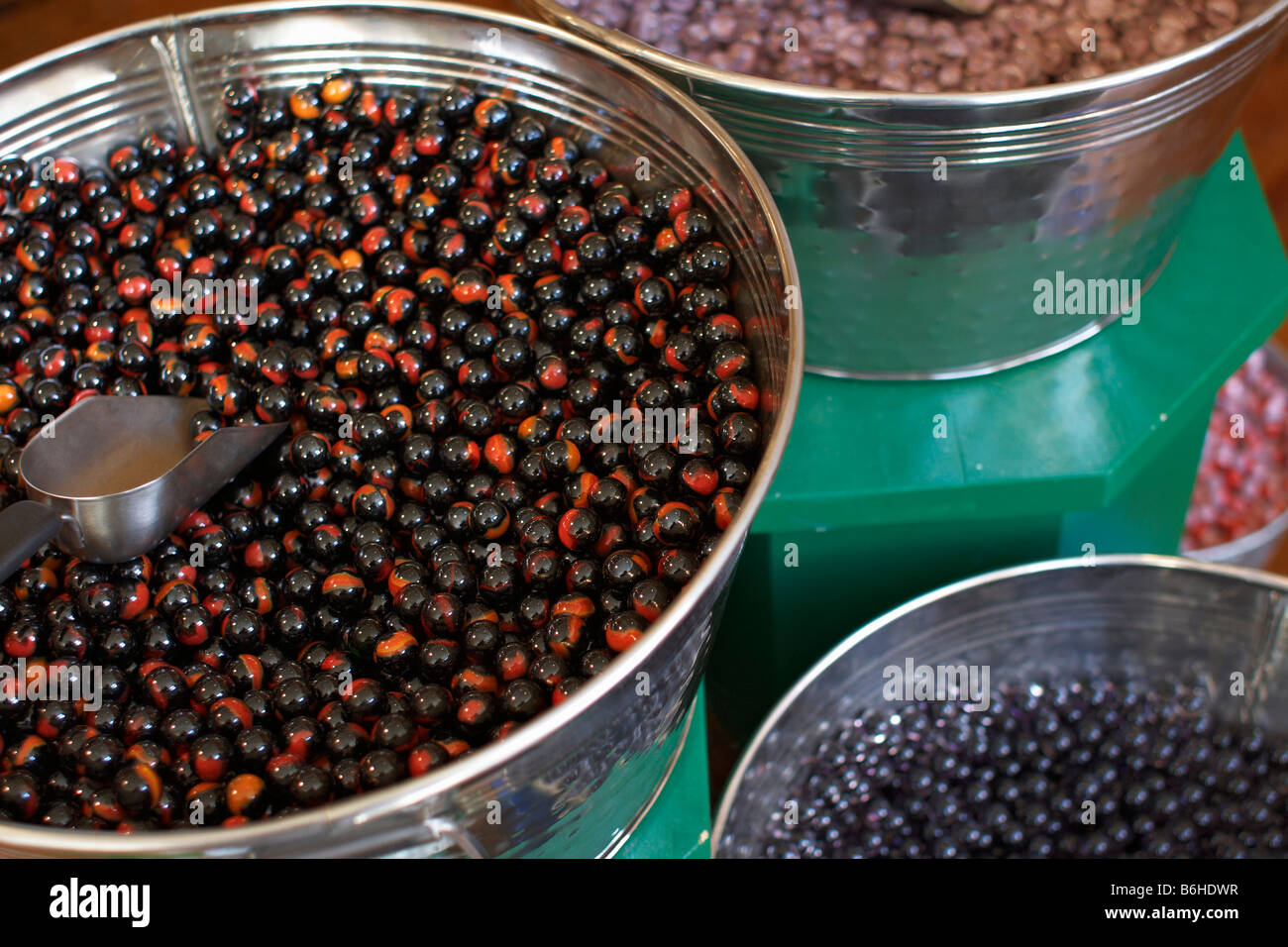 A buckets of marbles with scoops Stock Photo - Alamy