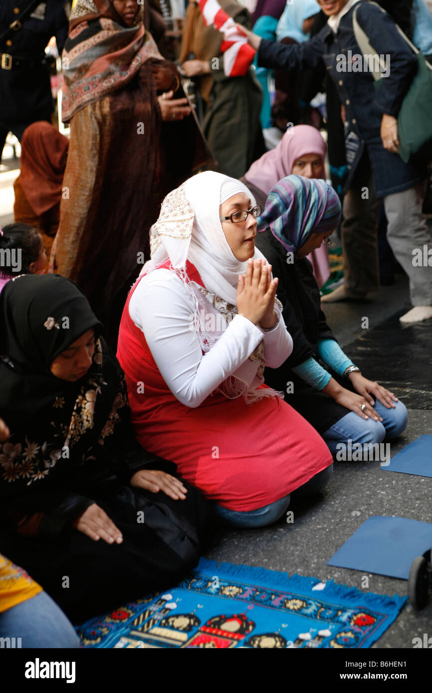 Muslim islam women girl prayer prayers nyc new york city hi-res stock ...
