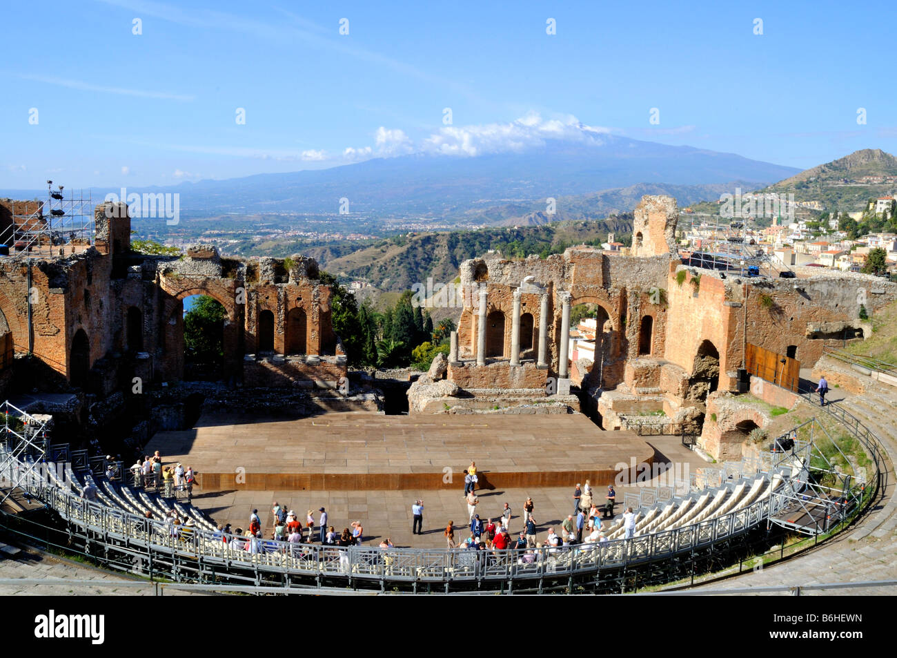 The Ancient Greek Theatre with Mount Etna behind in Taormina in Sicily ...