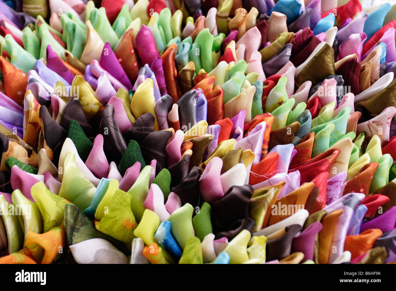Small pieces of cloth made into colourful mat Stock Photo - Alamy