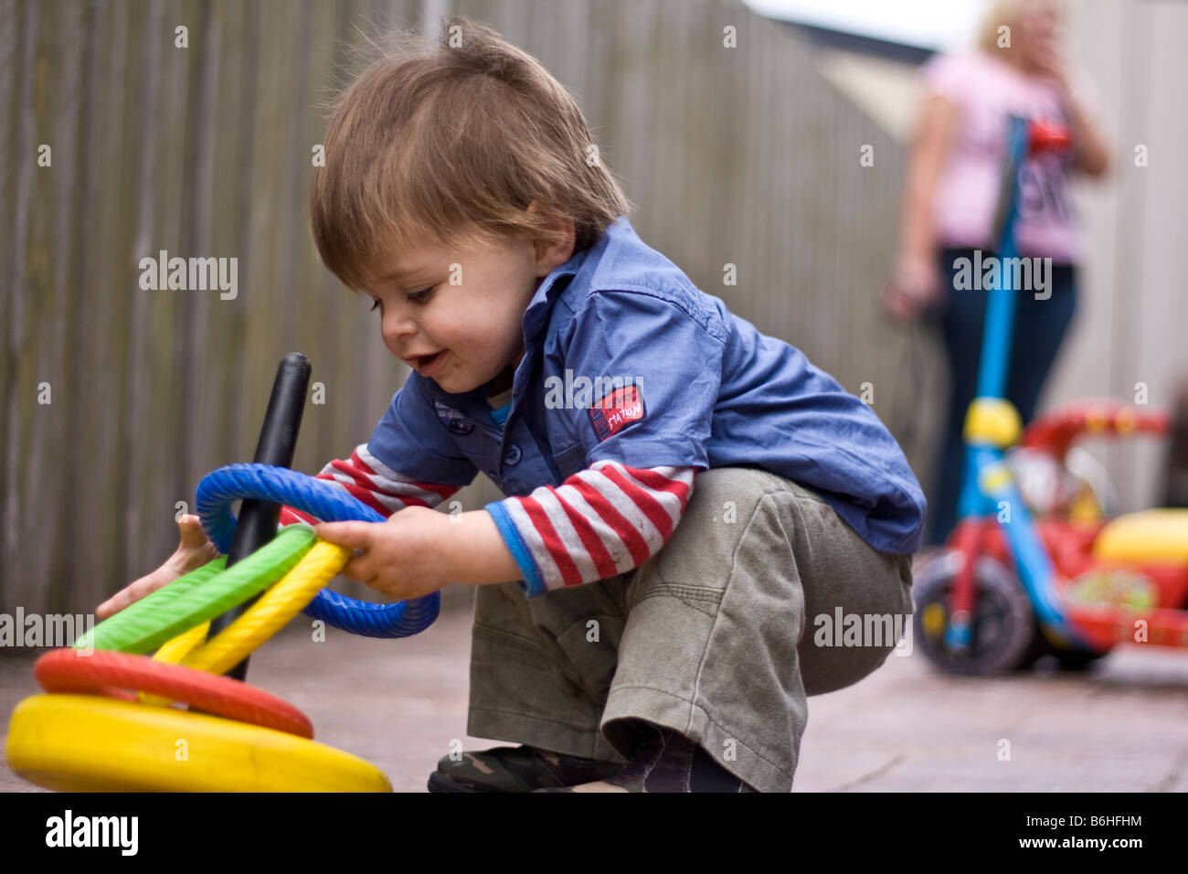 boy playing with rings Stock Photo - Alamy