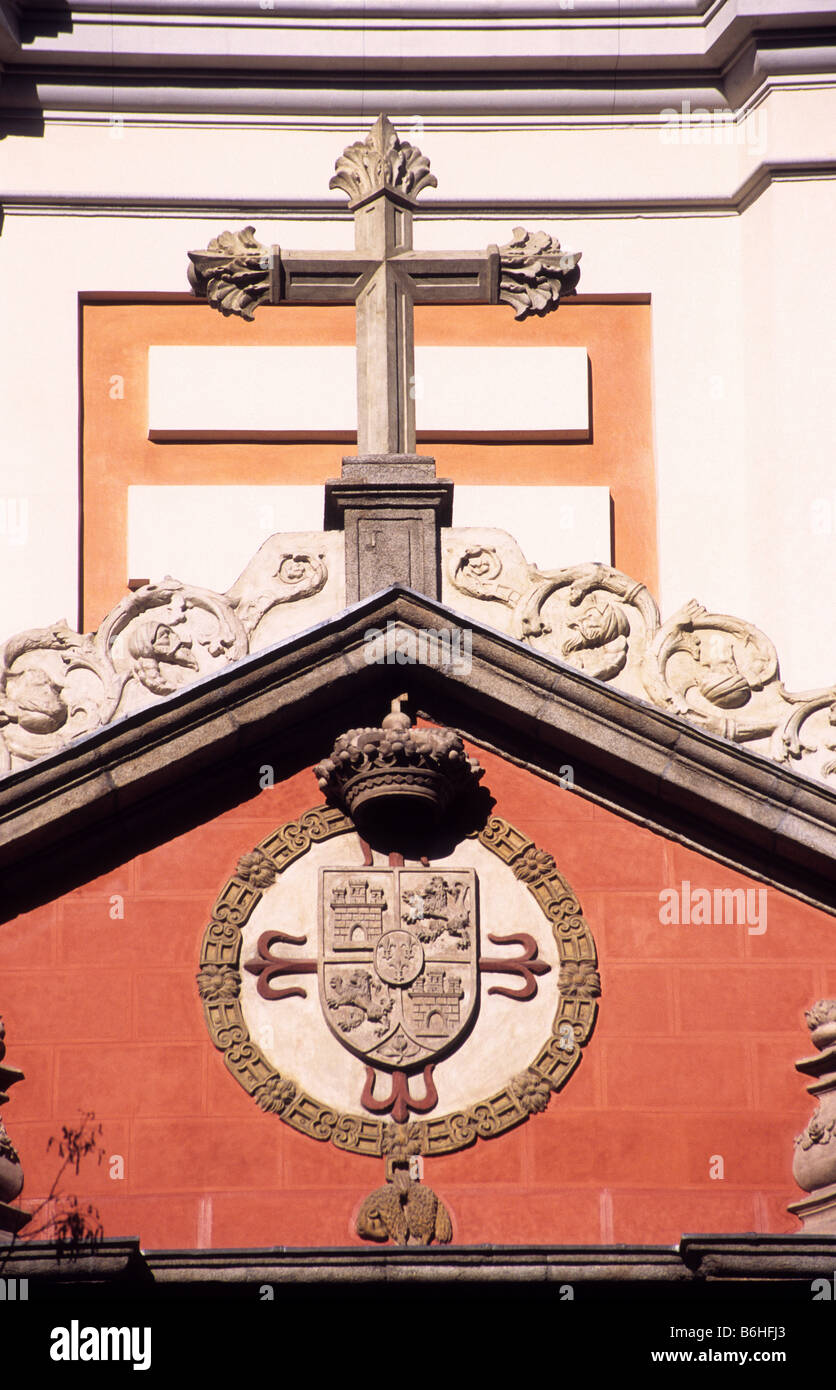 Close up detail of cross and coat of arms on facade of las Calatravas ...