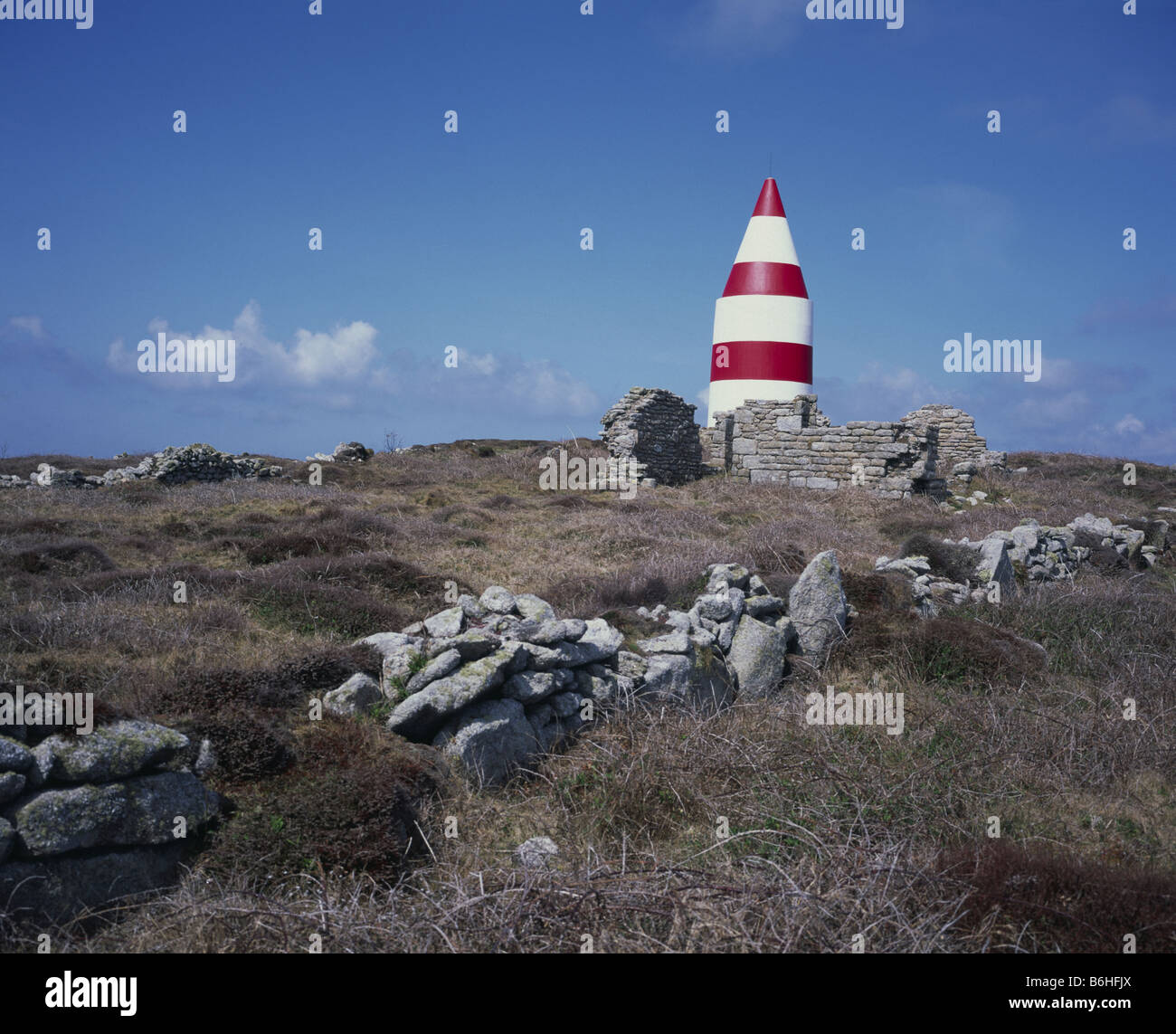 The red and white Daymark with ruins of an early Christian chapel in ...
