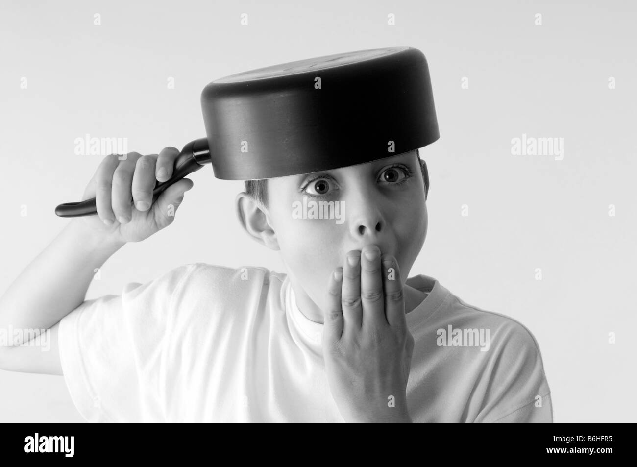 funny silly boy child messing about fun happy saucepan on head sauce ...