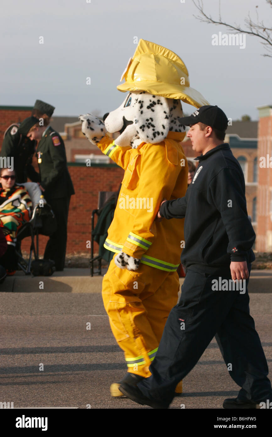 Fireman and mascot at christmas parade Stock Photo - Alamy