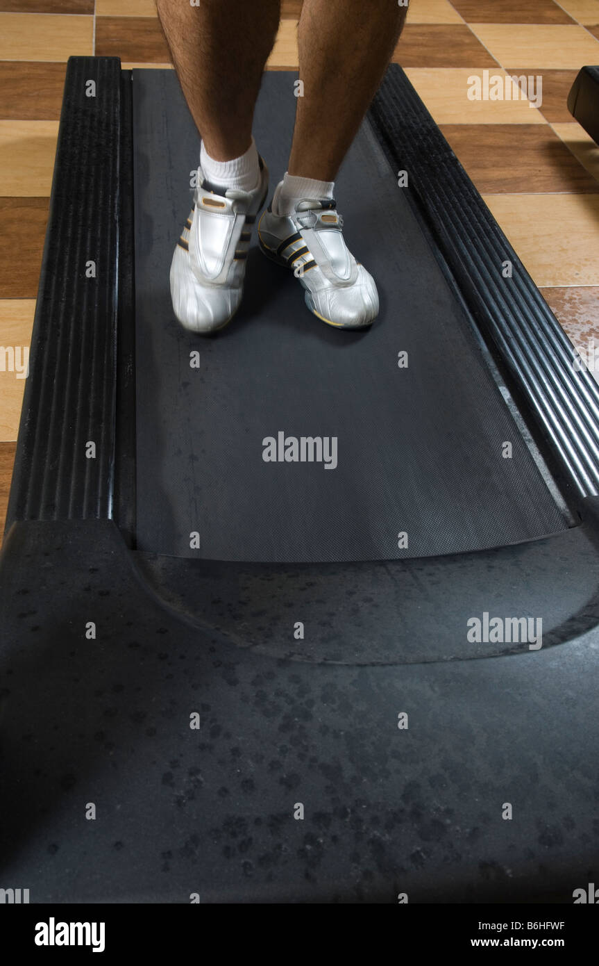 Close up of feet on treadmill Stock Photo - Alamy