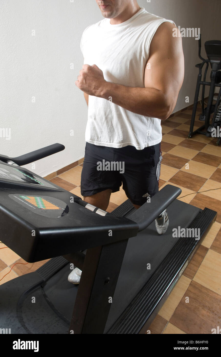 Man running on treadmill in a gym Stock Photo - Alamy