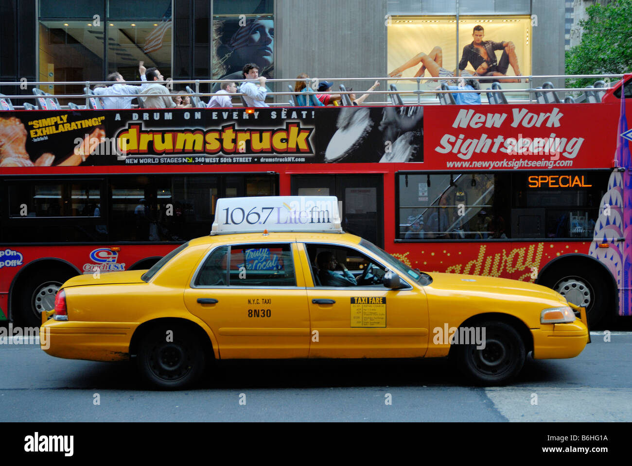 Yellow Taxi Cab and sightseeing bus in New York City, U.S.A Stock Photo ...