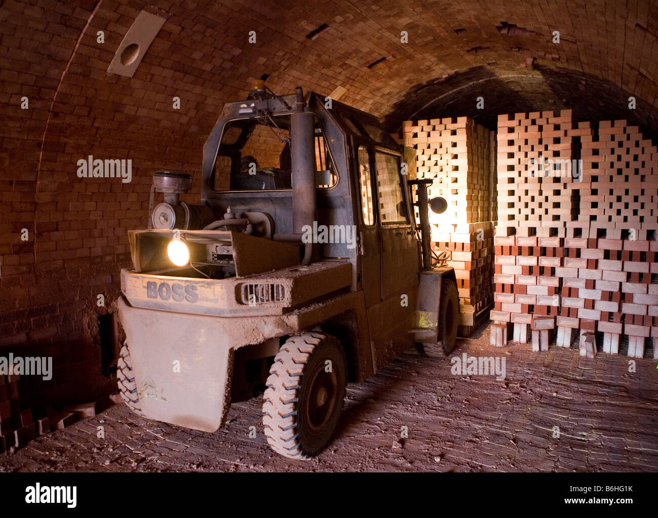 A forklift truck loads piles of London bricks in a kiln at the Kings ...