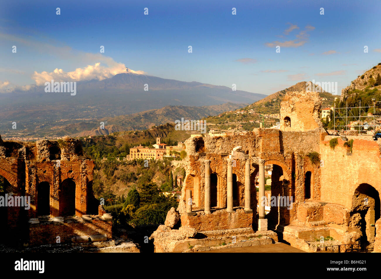 The Ancient Greek Theatre with Mount Etna behind in Taormina in Sicily ...
