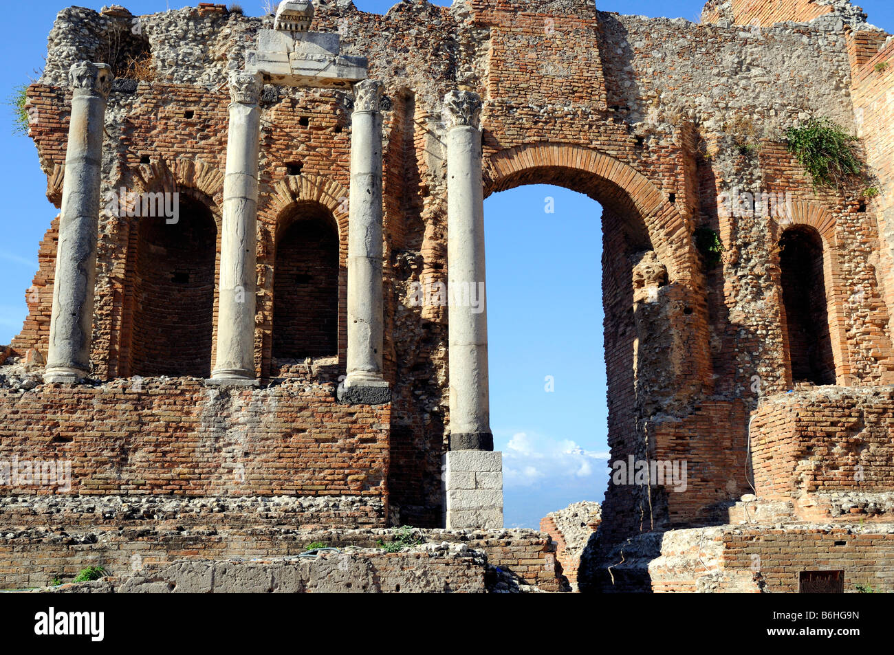 The Ancient Greek Theatre with Mount Etna behind in Taormina in Sicily ...