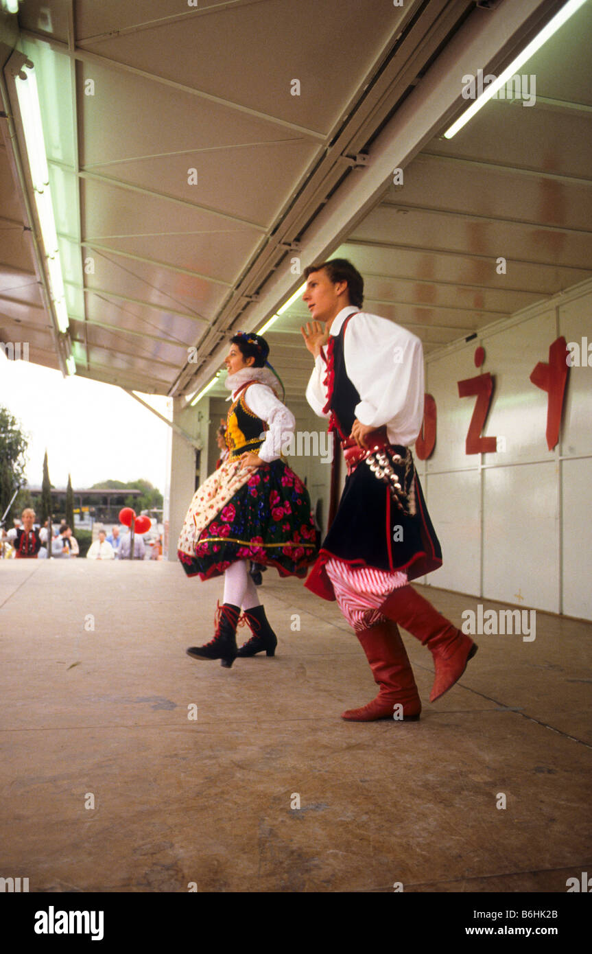 Man and woman in Polish costumes dance at traditional festival Stock ...
