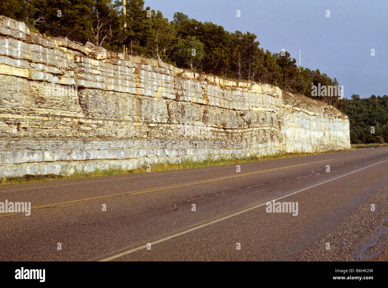 Rock strata is exposed by cut made for highway Stock Photo - Alamy