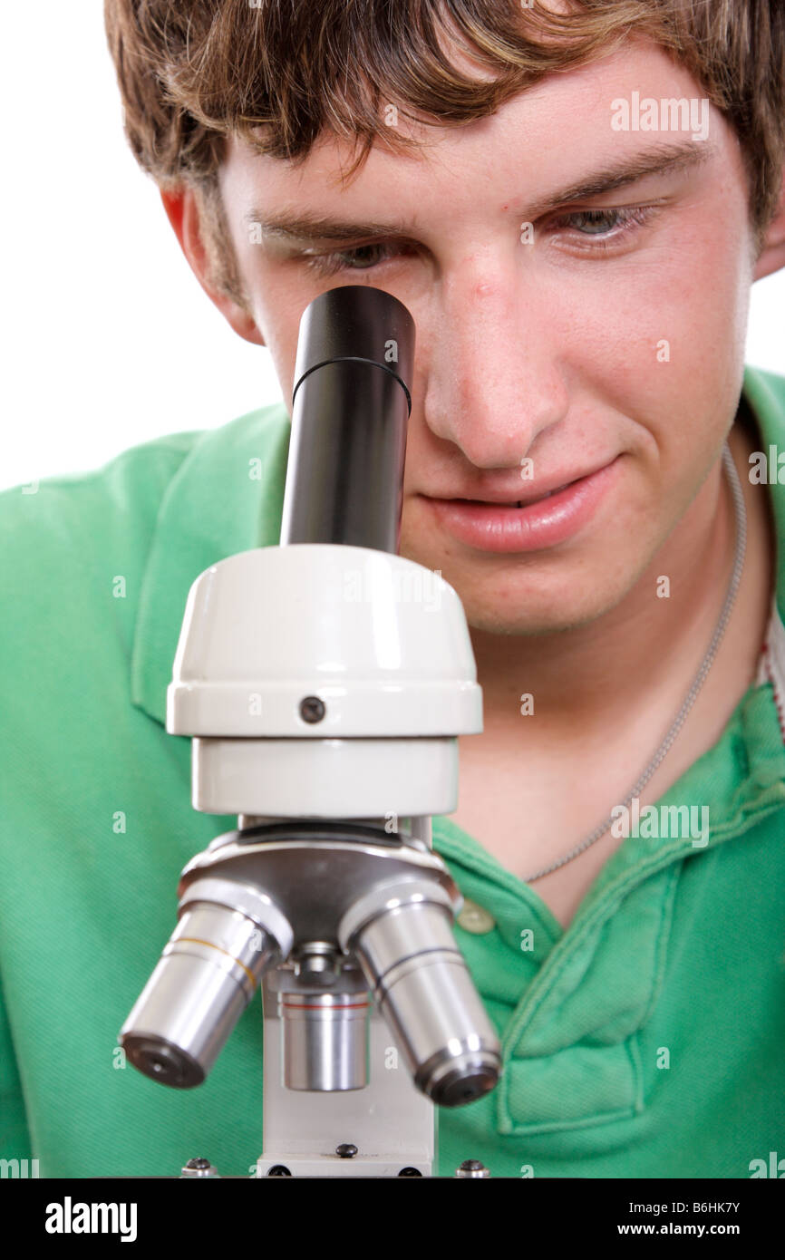 A teen student using a microscope Stock Photo - Alamy