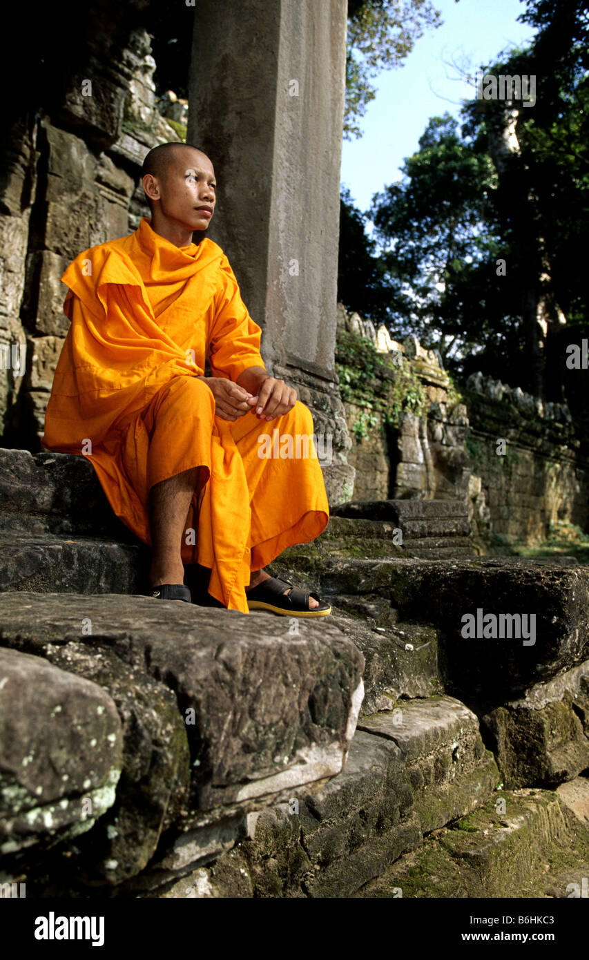 Novice monk in saffron robes at the unrstored 12th century temple of ...