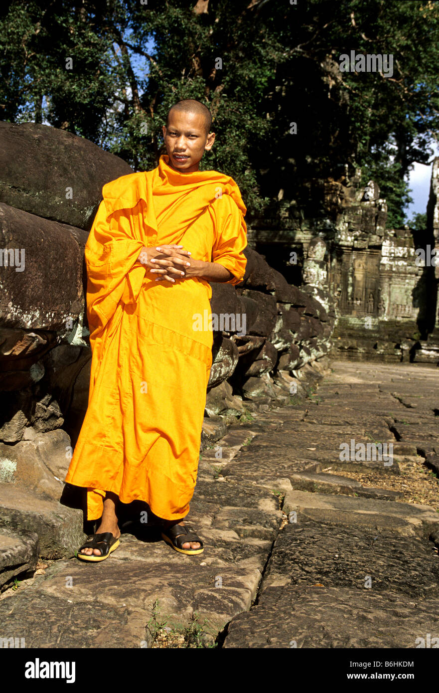 Novice monk in saffron robes at the unrstored 12th century temple of ...