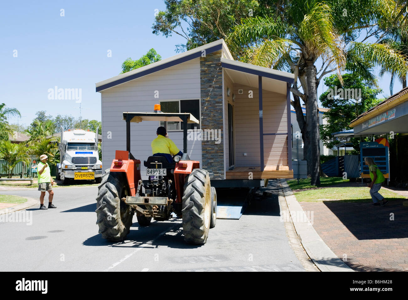 a prefabricated or mobile home attached to a tractor ready to be placed ...