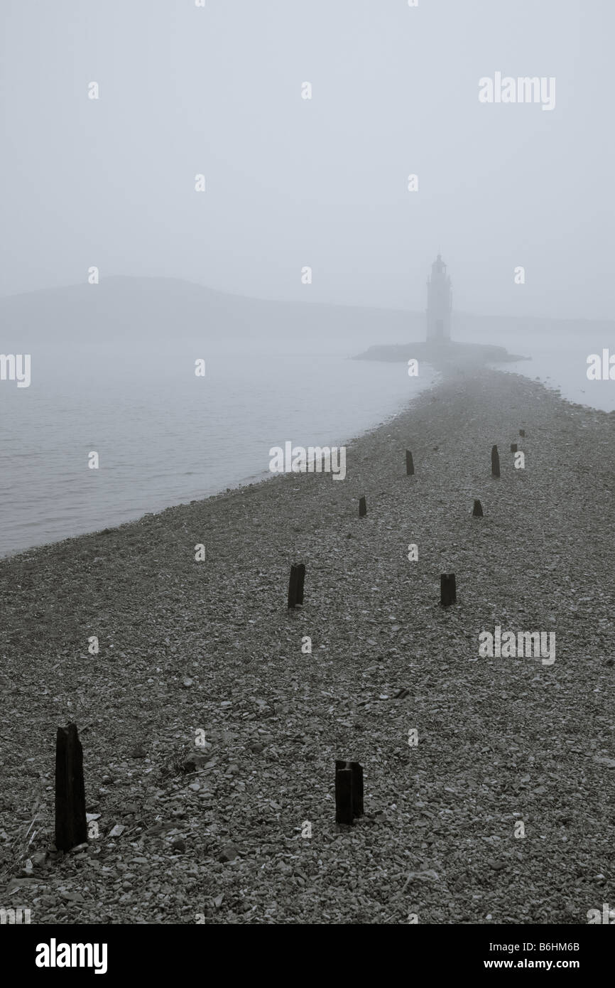 Lighthouse in fog Stock Photo - Alamy