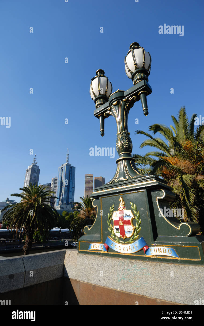Melbourne's iconic lamp posts adorn the Princes Bridge that spans the ...
