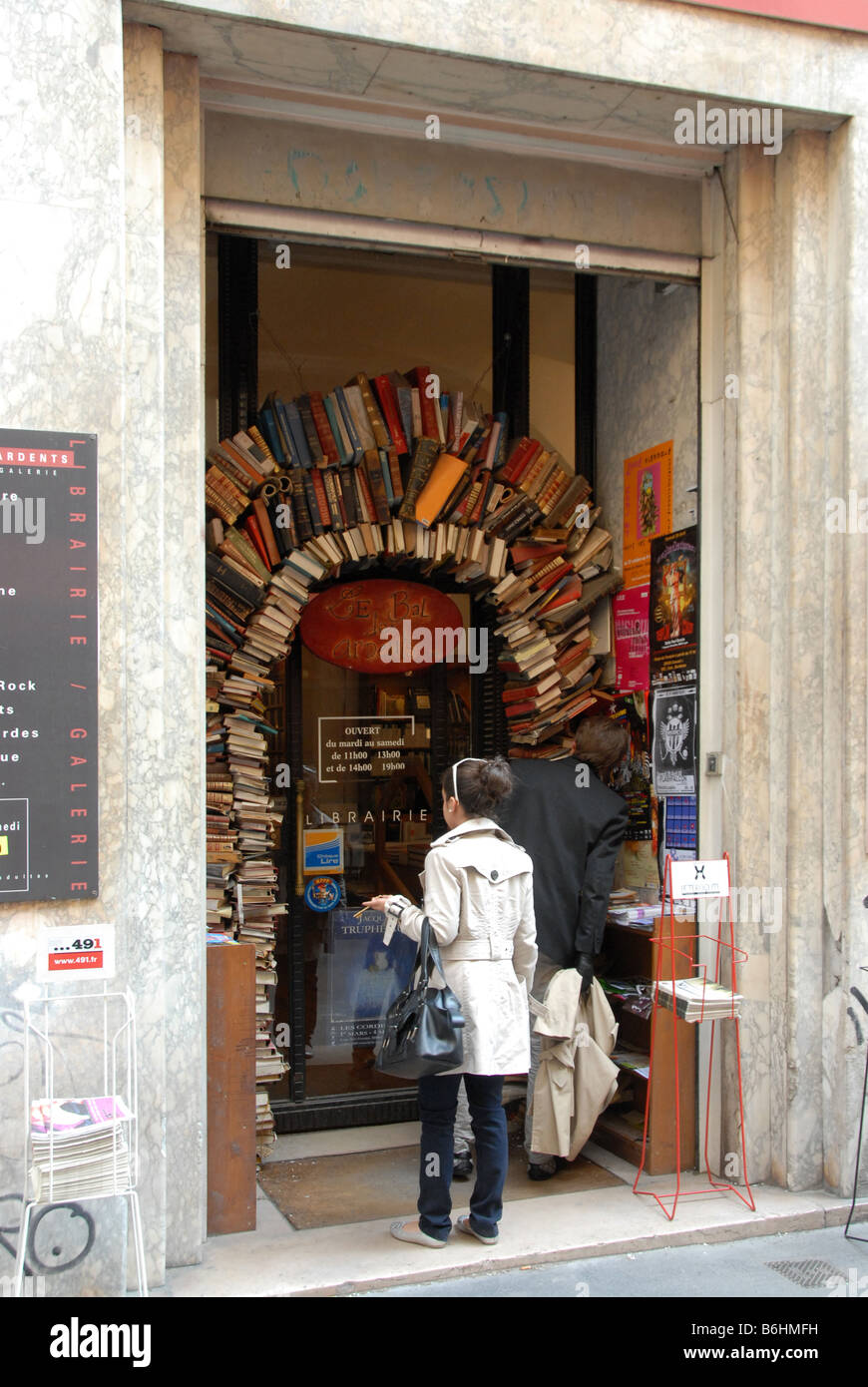 A customer standing at the main entrance to a doorway stacked with ...