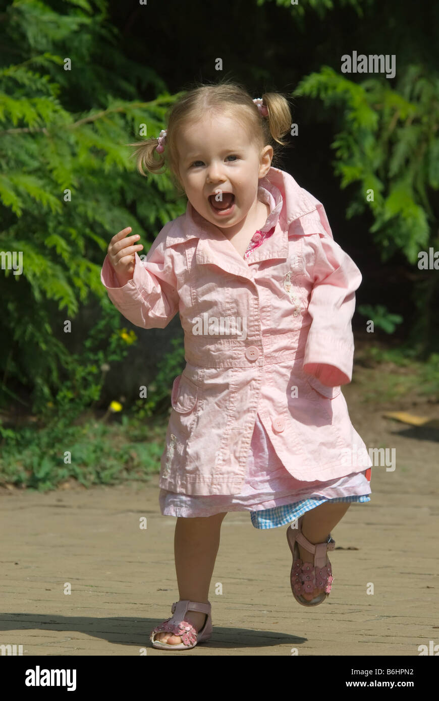 Baby girl taking first steps hi-res stock photography and images - Alamy